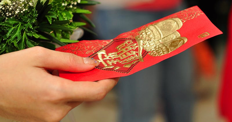Why Do The Chinese Give Out Ang Pows During Chinese New Year?